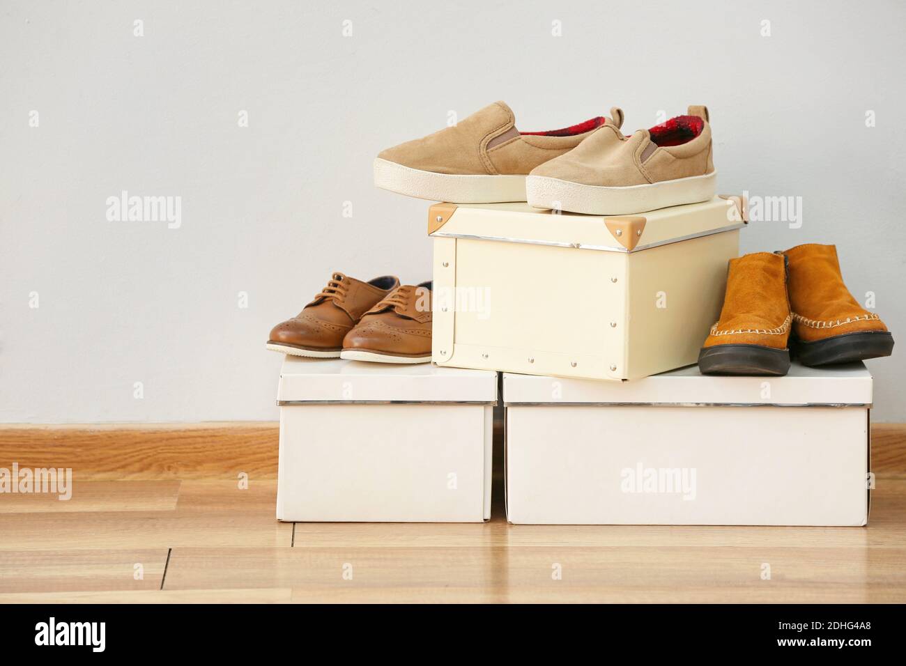 Stylish child's shoes on boxes Stock Photo - Alamy