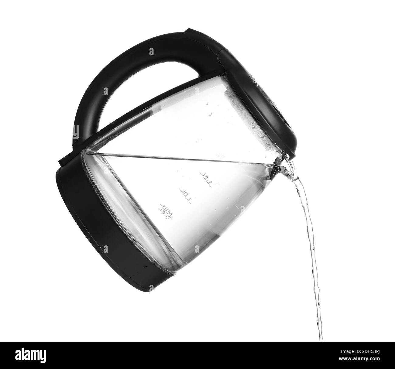 Pouring of boiled water from electric kettle on white background Stock ...