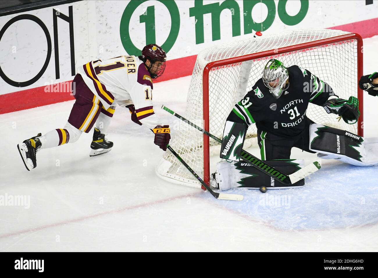 December 10, 2020 North Dakota Fighting Hawks goaltender Adam Scheel (31) stops a wraparound ...
