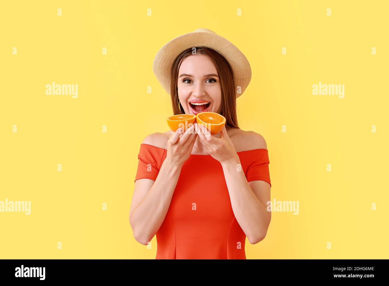 Beautiful young woman with orange slices on color background Stock ...