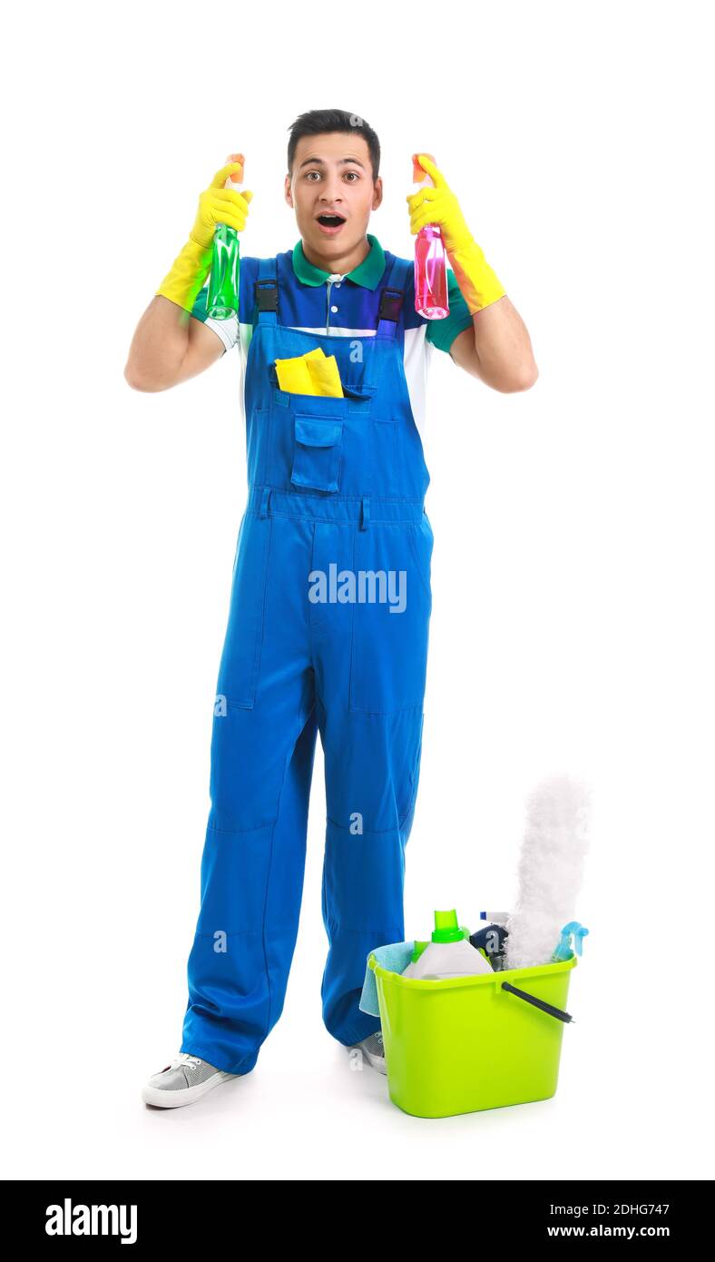 Surprised male janitor with cleaning supplies on white background Stock ...
