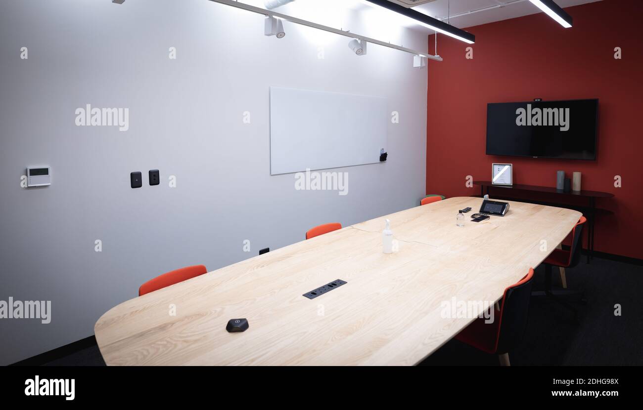 Conference room with whiteboard and television screen prepared for ...