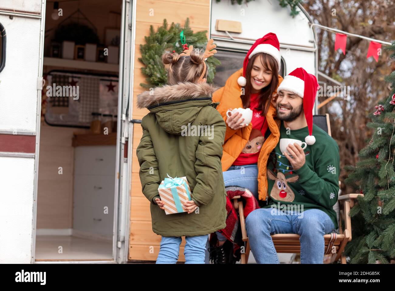 Happy family celebrating Christmas outdoors Stock Photo - Alamy
