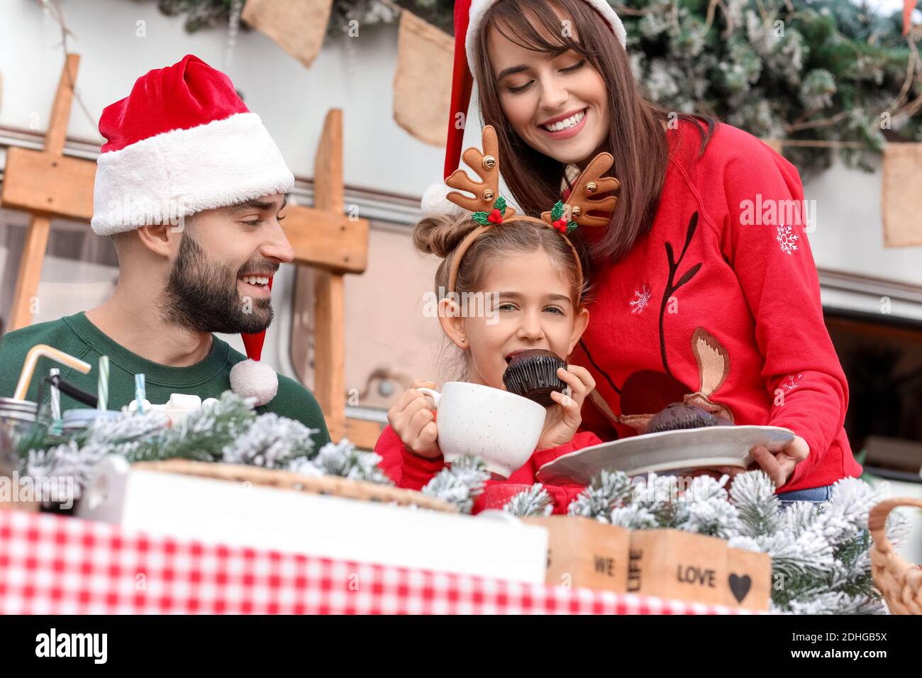 Happy family celebrating Christmas outdoors Stock Photo - Alamy