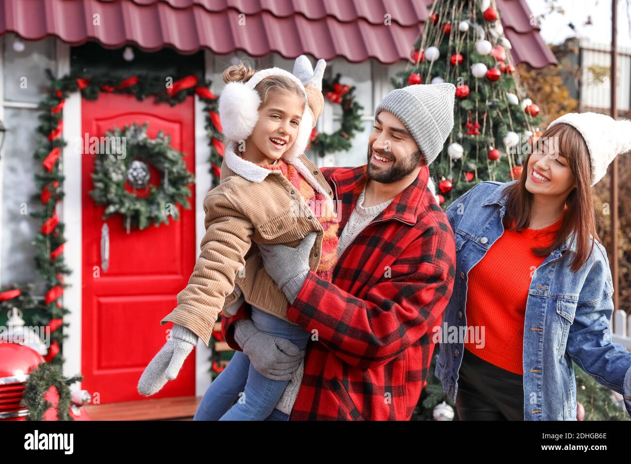 Happy family celebrating Christmas outdoors Stock Photo - Alamy