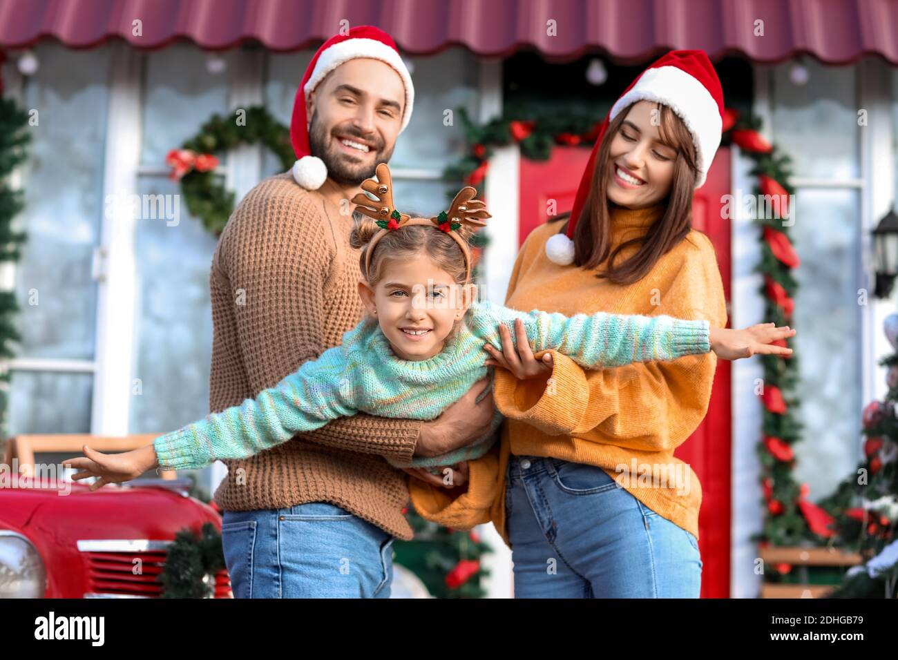 Happy family celebrating Christmas outdoors Stock Photo - Alamy