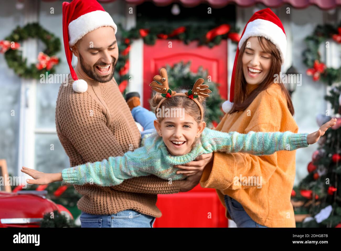 Happy family celebrating Christmas outdoors Stock Photo - Alamy