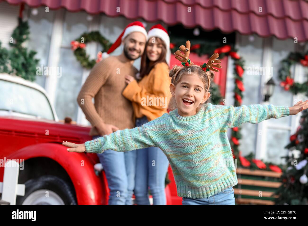 Happy family celebrating Christmas outdoors Stock Photo - Alamy