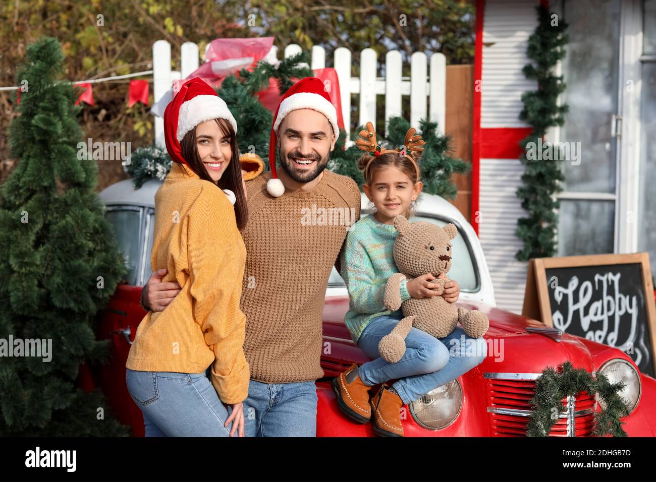 Happy family celebrating Christmas outdoors Stock Photo - Alamy