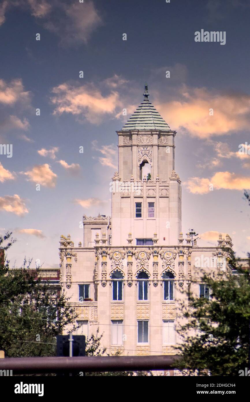shot of an old church tower in pastel pink city at sunset Stock Photo ...
