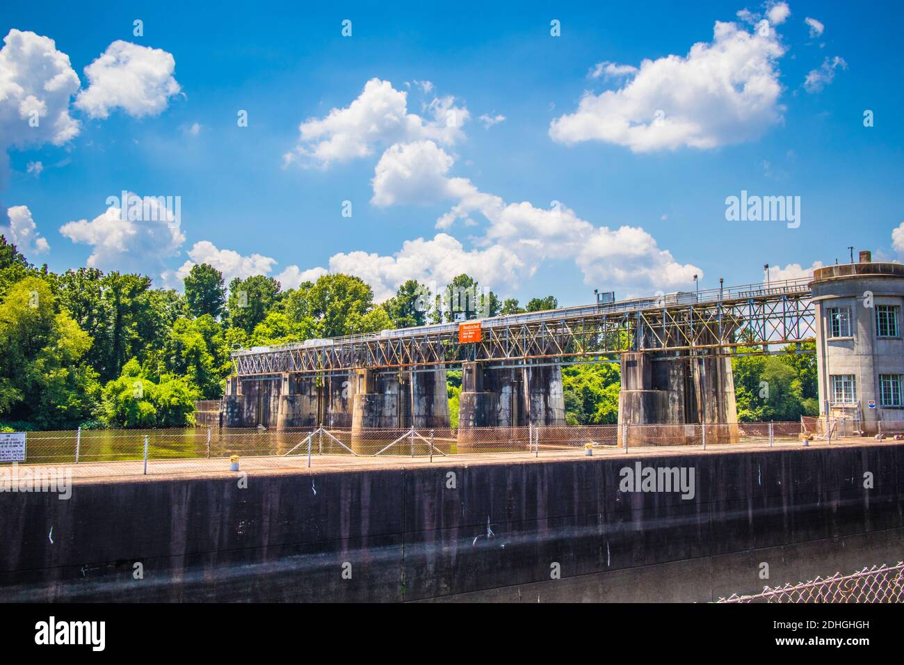 Augusta, Ga USA - 07 04 20: Lock and Dam concrete dam and tree line ...