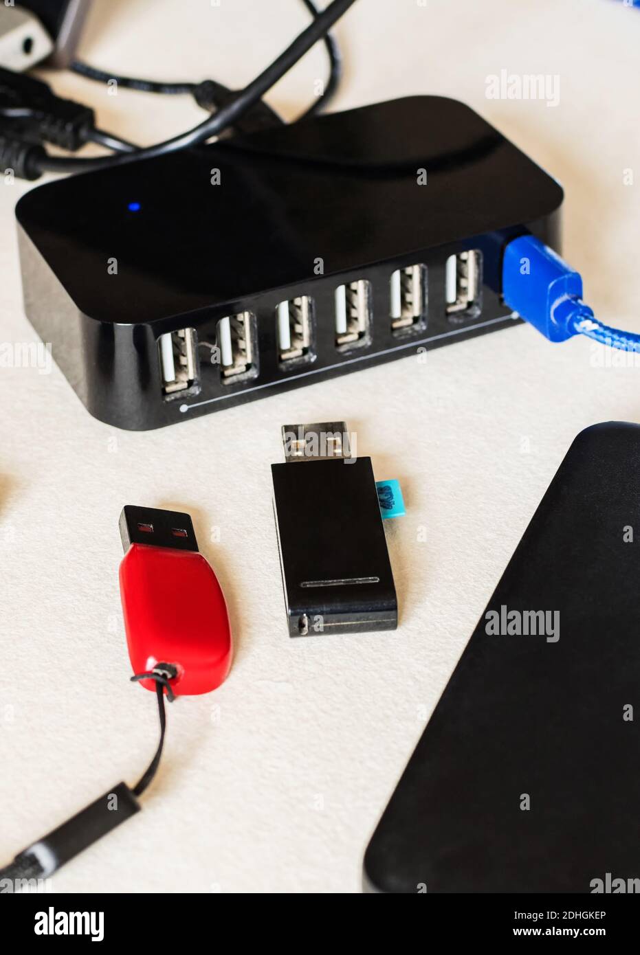 A vertical closeup of the flash drive, external drive, and multiple USB ...