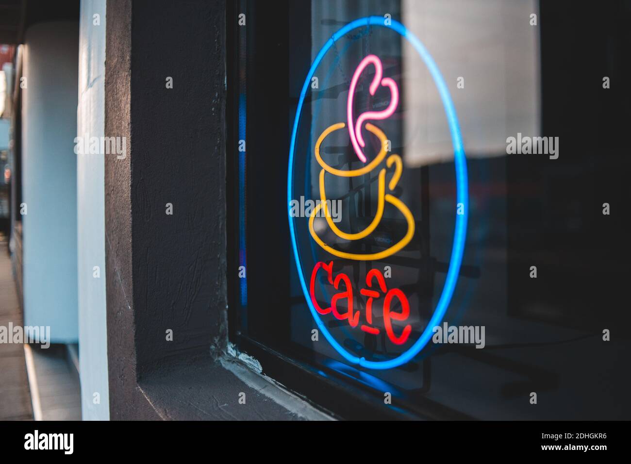 yellow red and blue neon cafe sign Stock Photo - Alamy