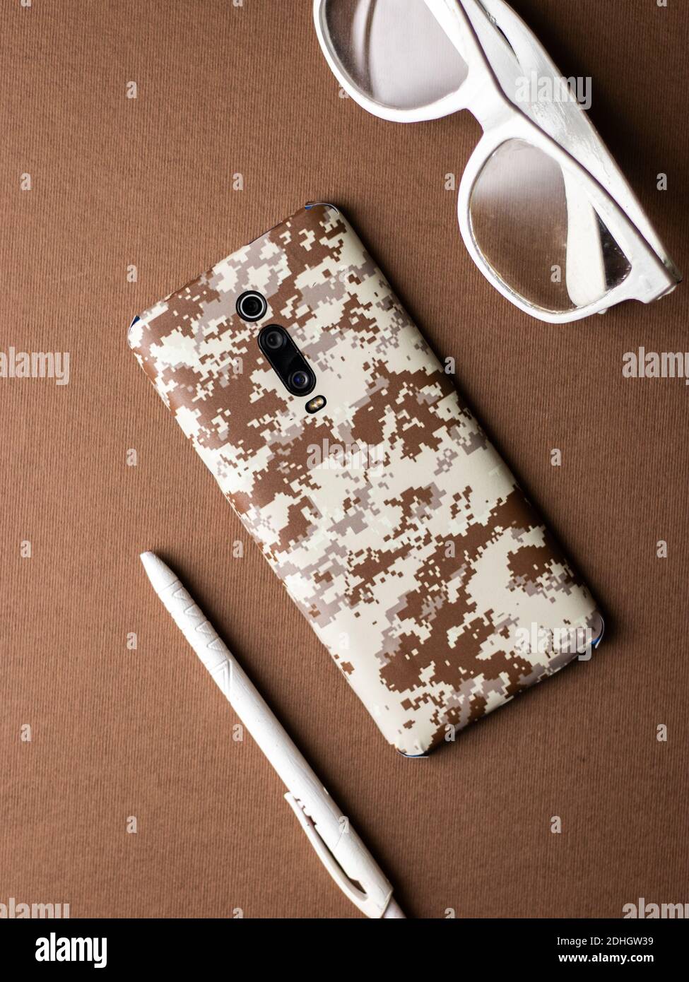 Custom phone skin flatlay with different background color Stock Photo ...