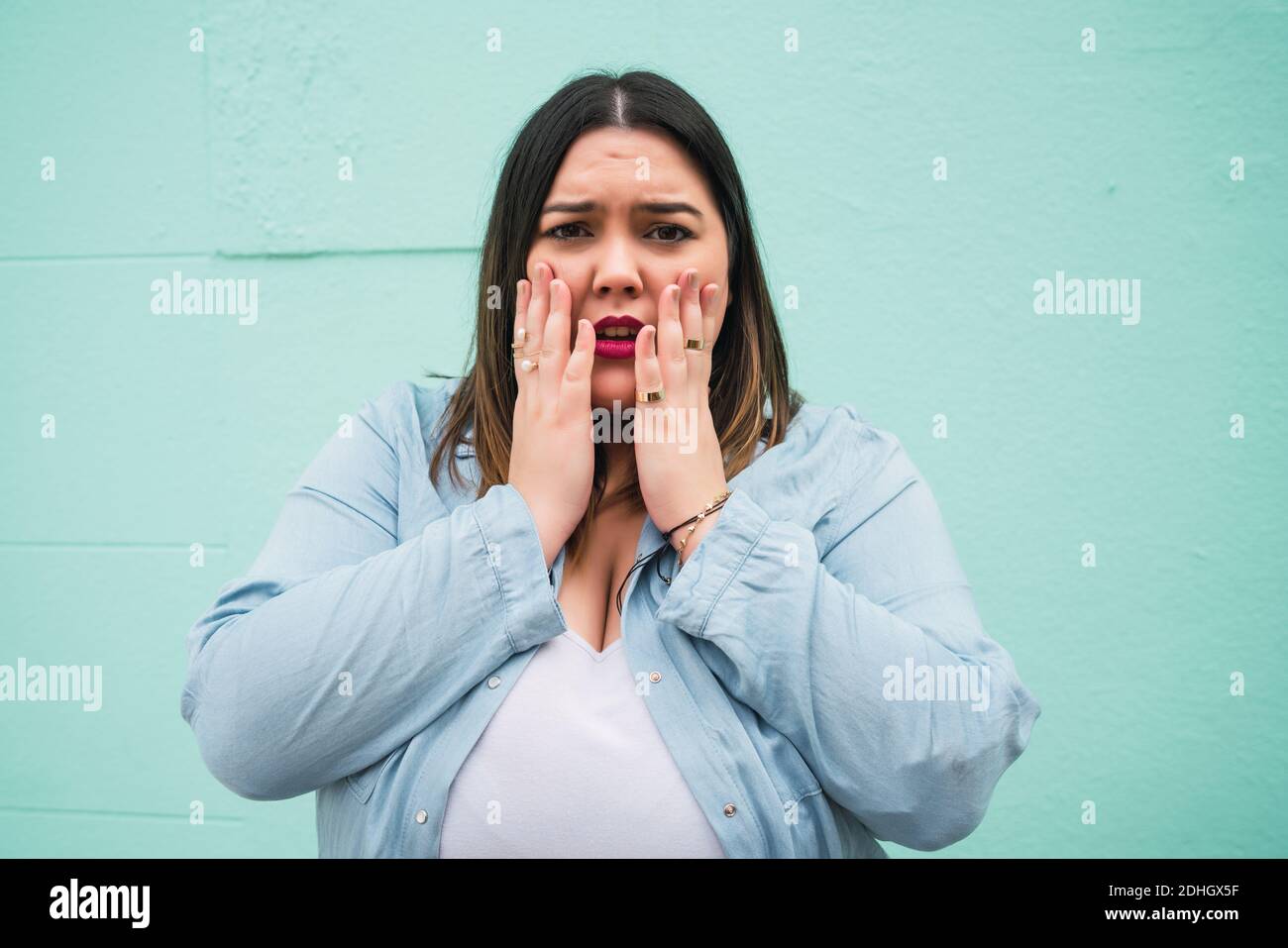 Young woman with shocked expression Stock Photo - Alamy