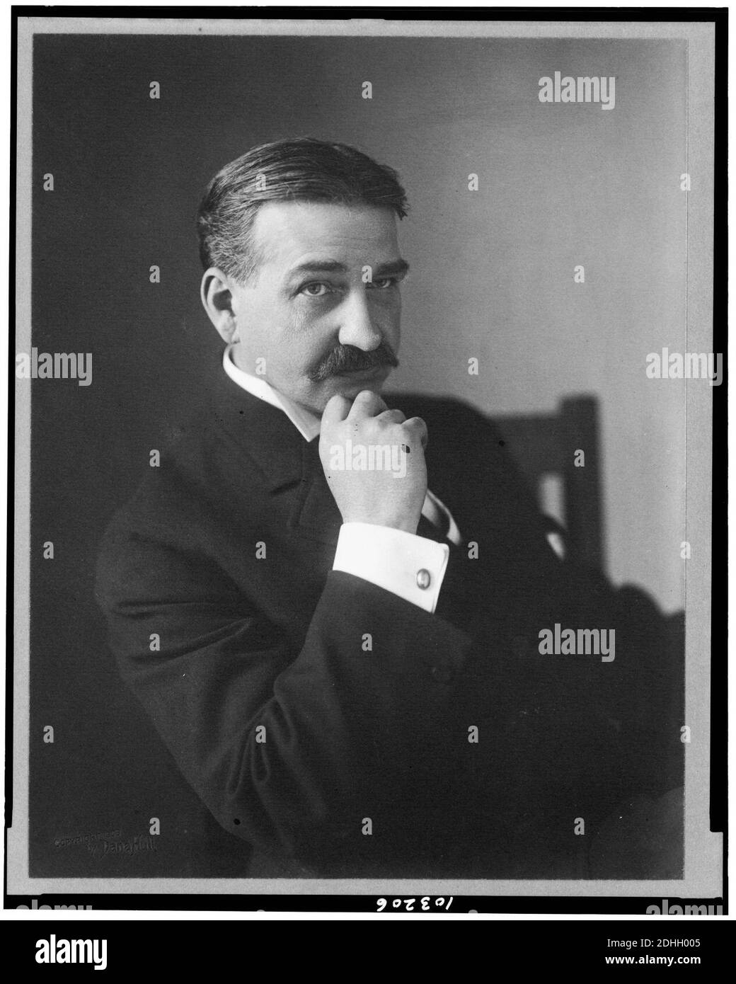 Classic hand on chin Black and White Stock Photos & Images - Alamy