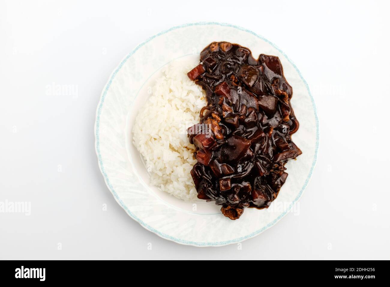 Jjajang rice in a dish on a white background Stock Photo - Alamy