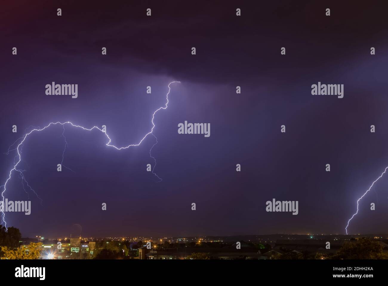 A mesmerizing shot of large lightning strike to ground Stock Photo - Alamy