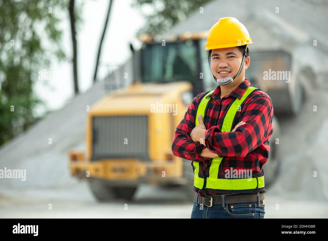 Engineer wear safety uniform backhoe excavator and bulldozer on ...