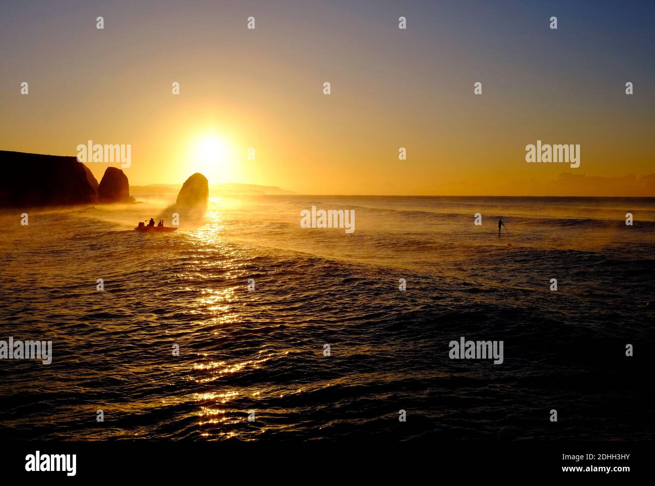 Sunrise sun rising dawn daybreak on beach surf seaside RIB dinghy ...