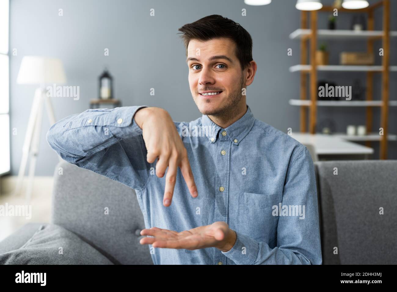 Adult Learning Sign Language For Deaf Disabled Stock Photo - Alamy