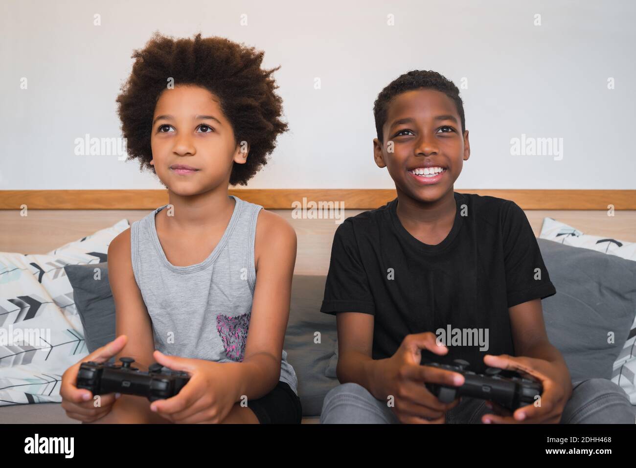 Two brothers playing video games at home Stock Photo - Alamy Two brothers playing video games at home Stock Photo - Alamy