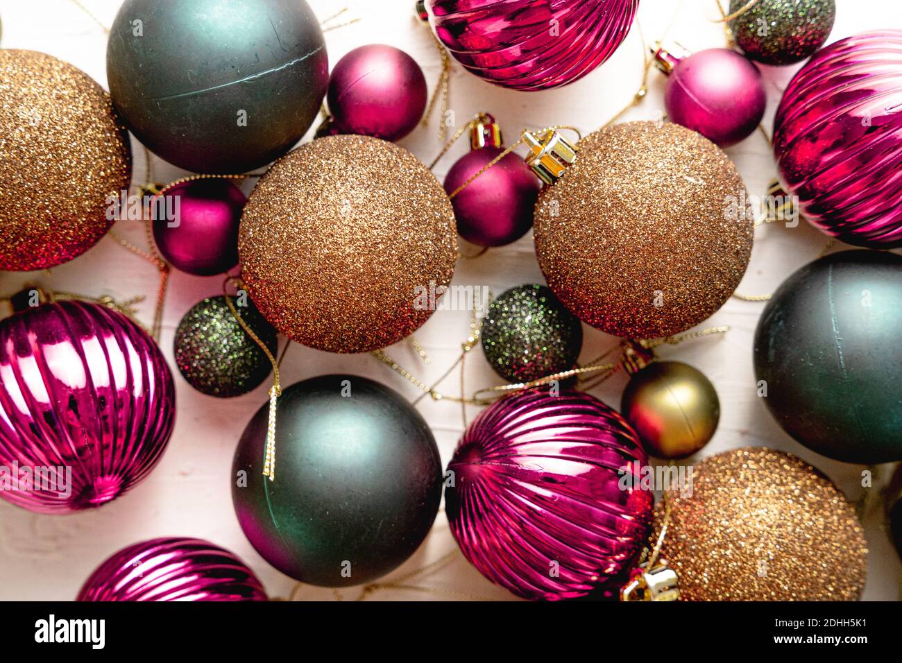 A Christmas background with bronze, purple, and gray balls, seamless ...