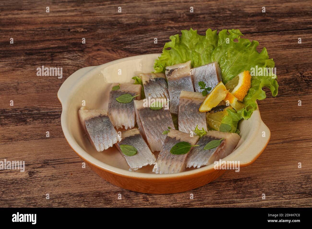 Marinated Herring fillet with sliced lemon Stock Photo - Alamy