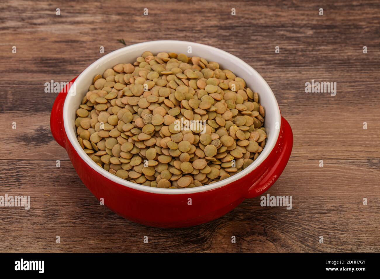 Vegan cuisine - Dry lentil heap isolated Stock Photo - Alamy
