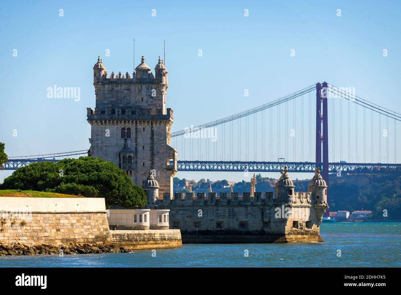 Scenic Belem Tower and wooden bridge miroring with low tides on Tagus ...