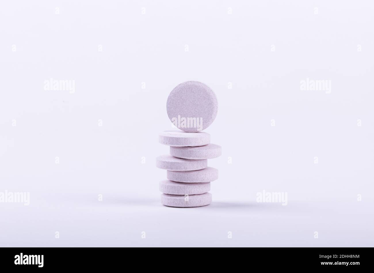 A stack of white round tablets isolated on white background Stock Photo ...