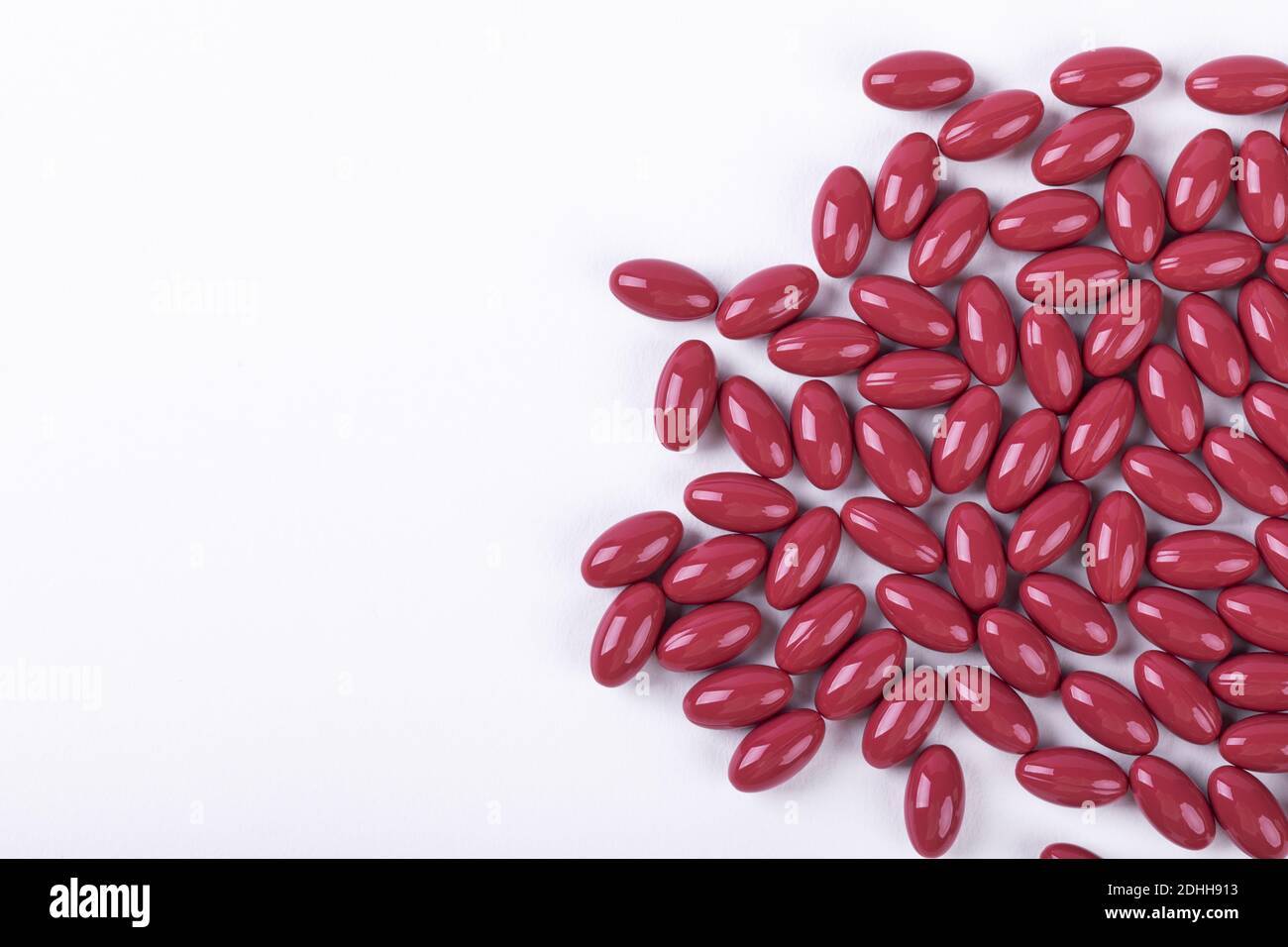 A top view of red gel capsules isolated on white background Stock Photo ...