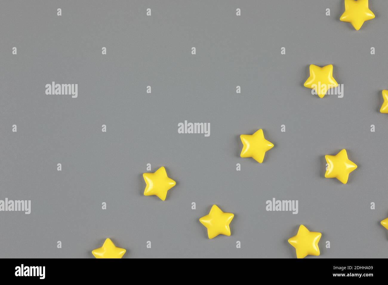 yellow decorative stars sparse on neutral gray background Stock Photo ...
