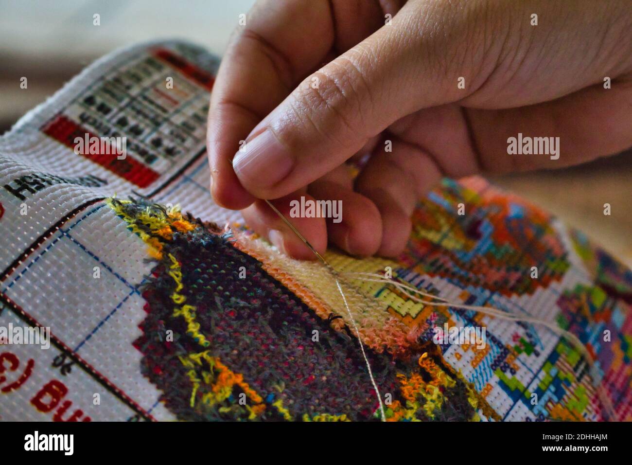 A person embroidering cute Asian cartoons Stock Photo - Alamy