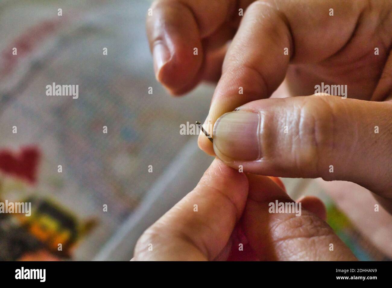 Threading cross hi-res stock photography and images - Alamy