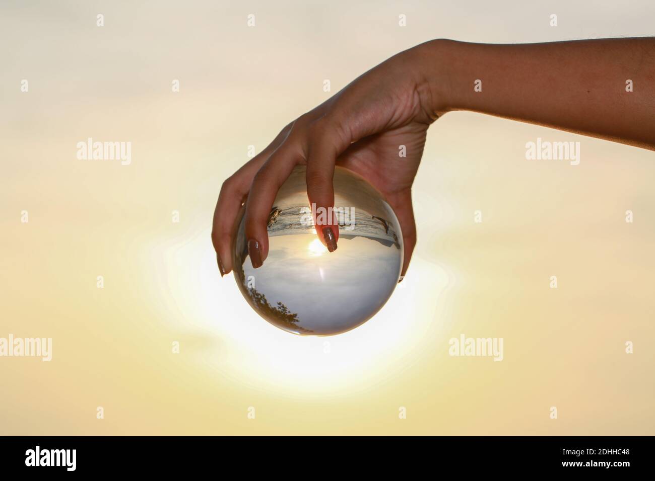 lady catch the crystal ball on her hand beside Patong beach during ...