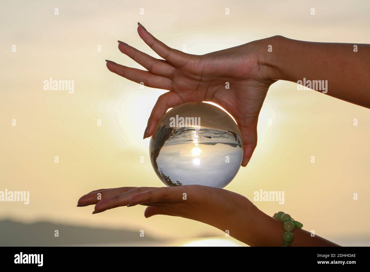 lady catch the crystal ball on her hand beside Patong beach during ...