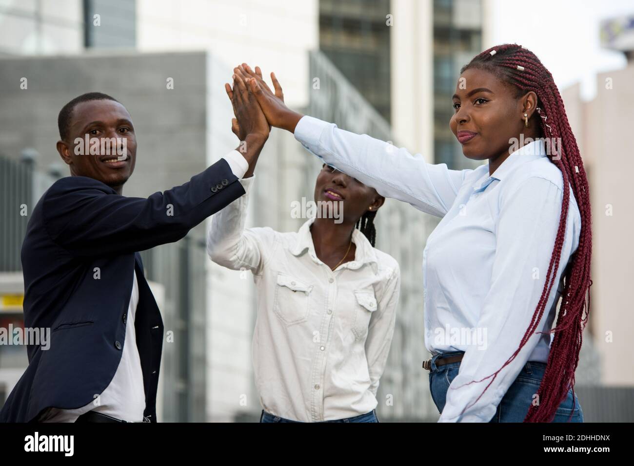 Young people standing in the street greeting each other, look at the ...