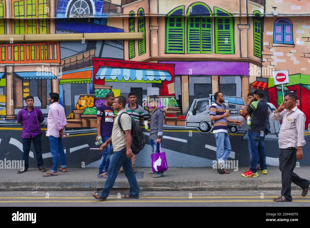 Bangladeshi workers in front of a wall painting in Desker Road in ...