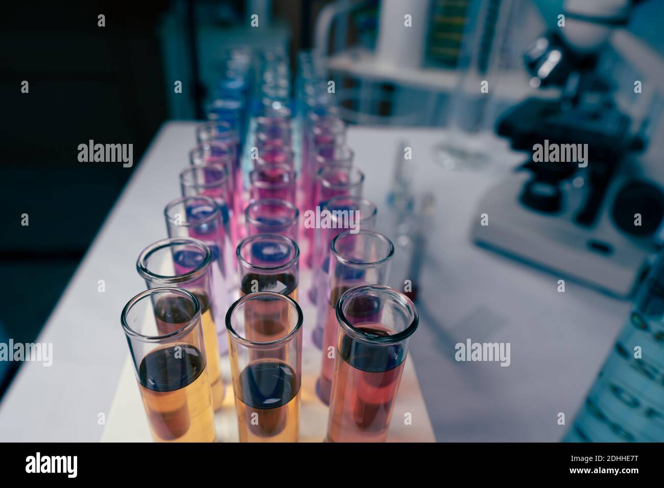 Liquid drop falling into test tubes Stock Photo - Alamy
