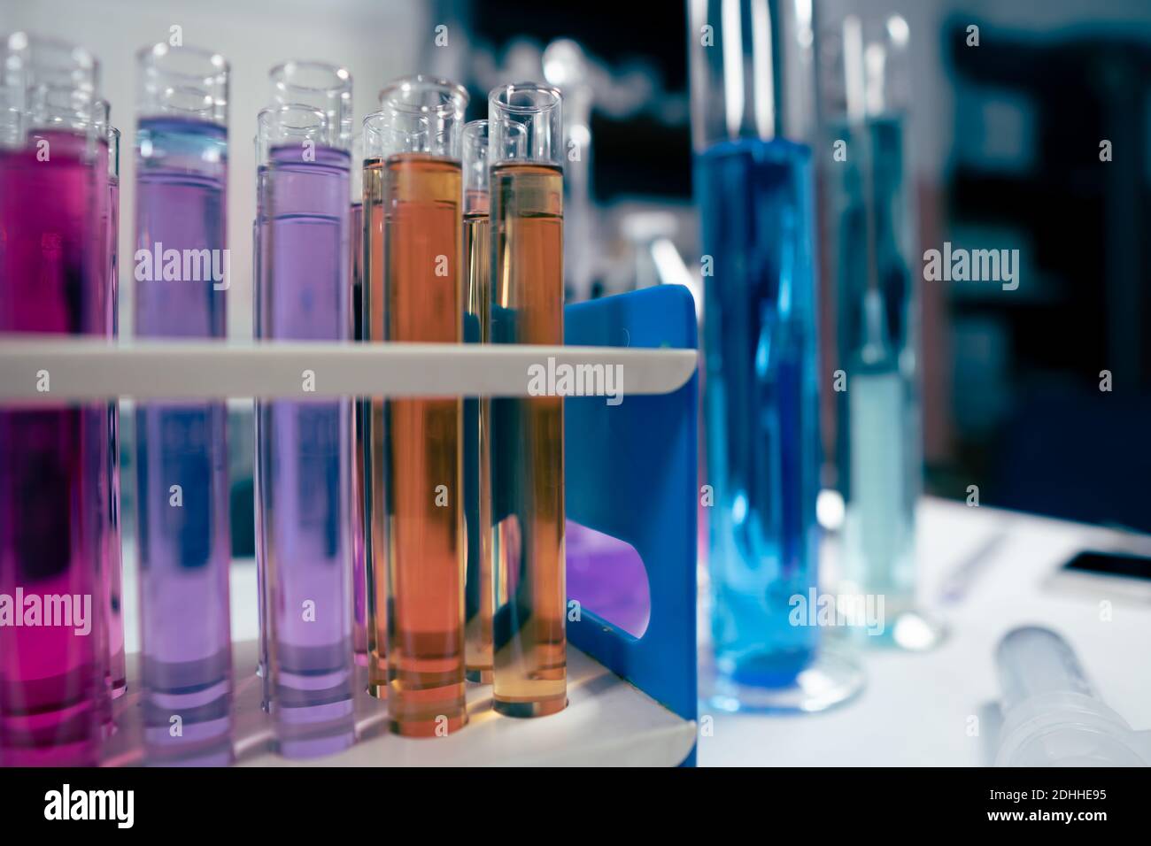 Liquid drop falling into test tubes Stock Photo - Alamy