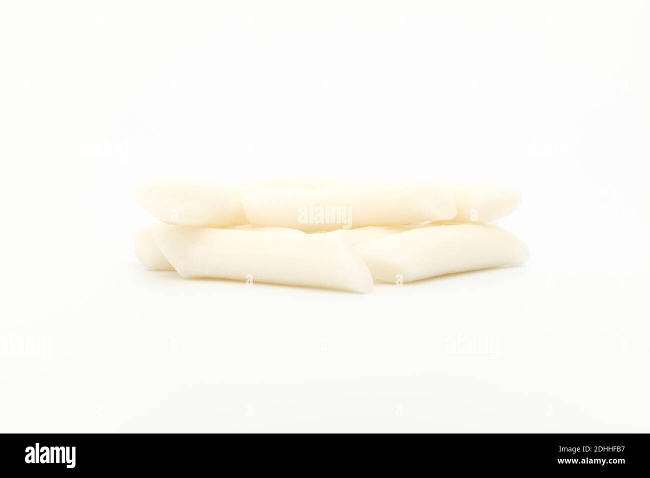 Tteokbokki rice cake on white background Stock Photo - Alamy