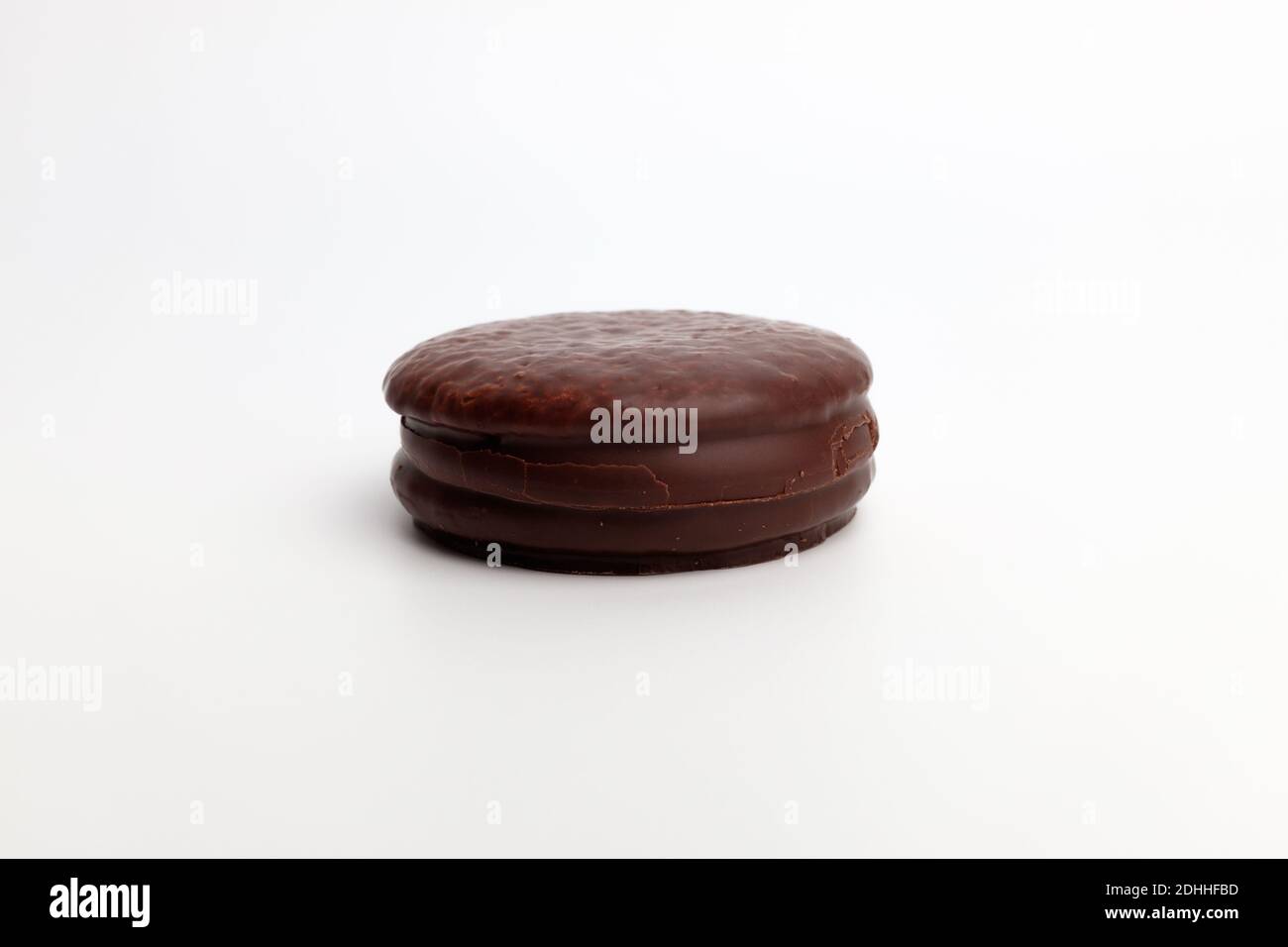 Chocolate coated pie on white background Stock Photo - Alamy