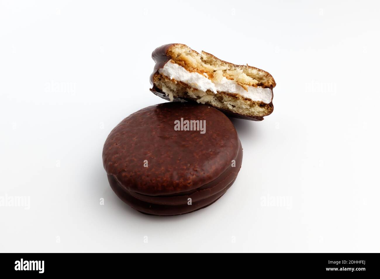 Chocolate coated pie on white background Stock Photo - Alamy