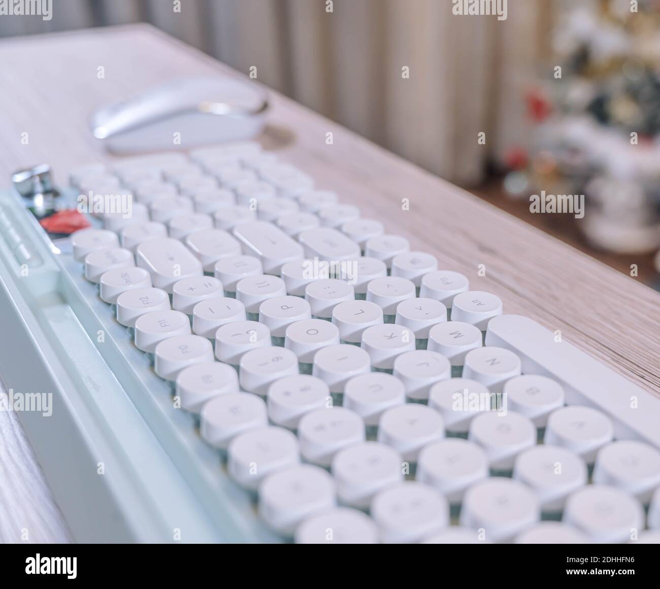 Retro white keyboard isolated on a wooden background. Keyboard close up ...