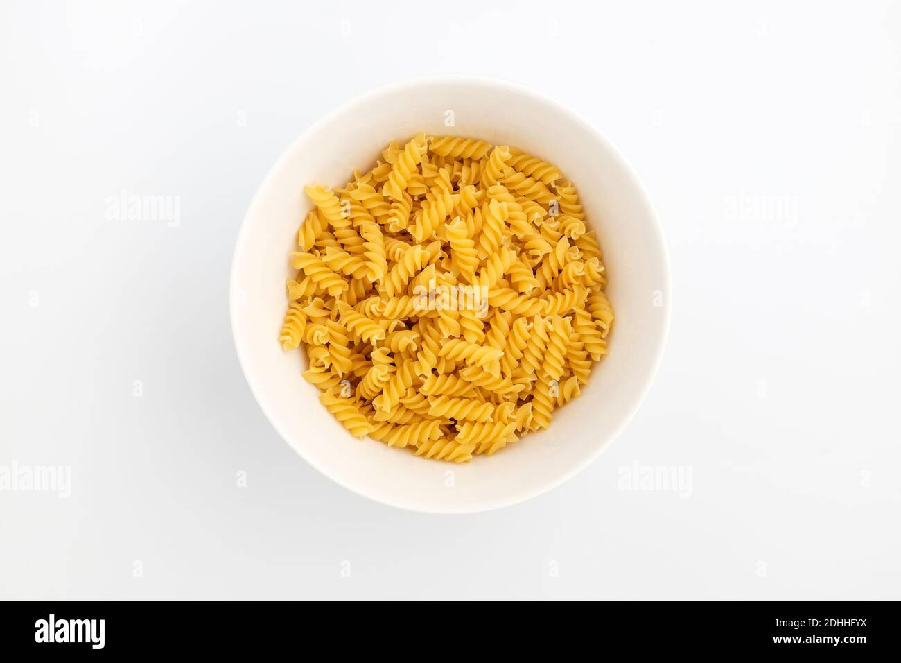 Spiral fusilli on a white background Stock Photo - Alamy