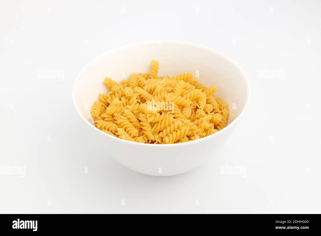 Spiral fusilli on a white background Stock Photo - Alamy
