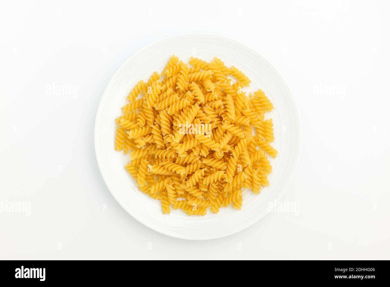 Spiral fusilli on a white background Stock Photo - Alamy