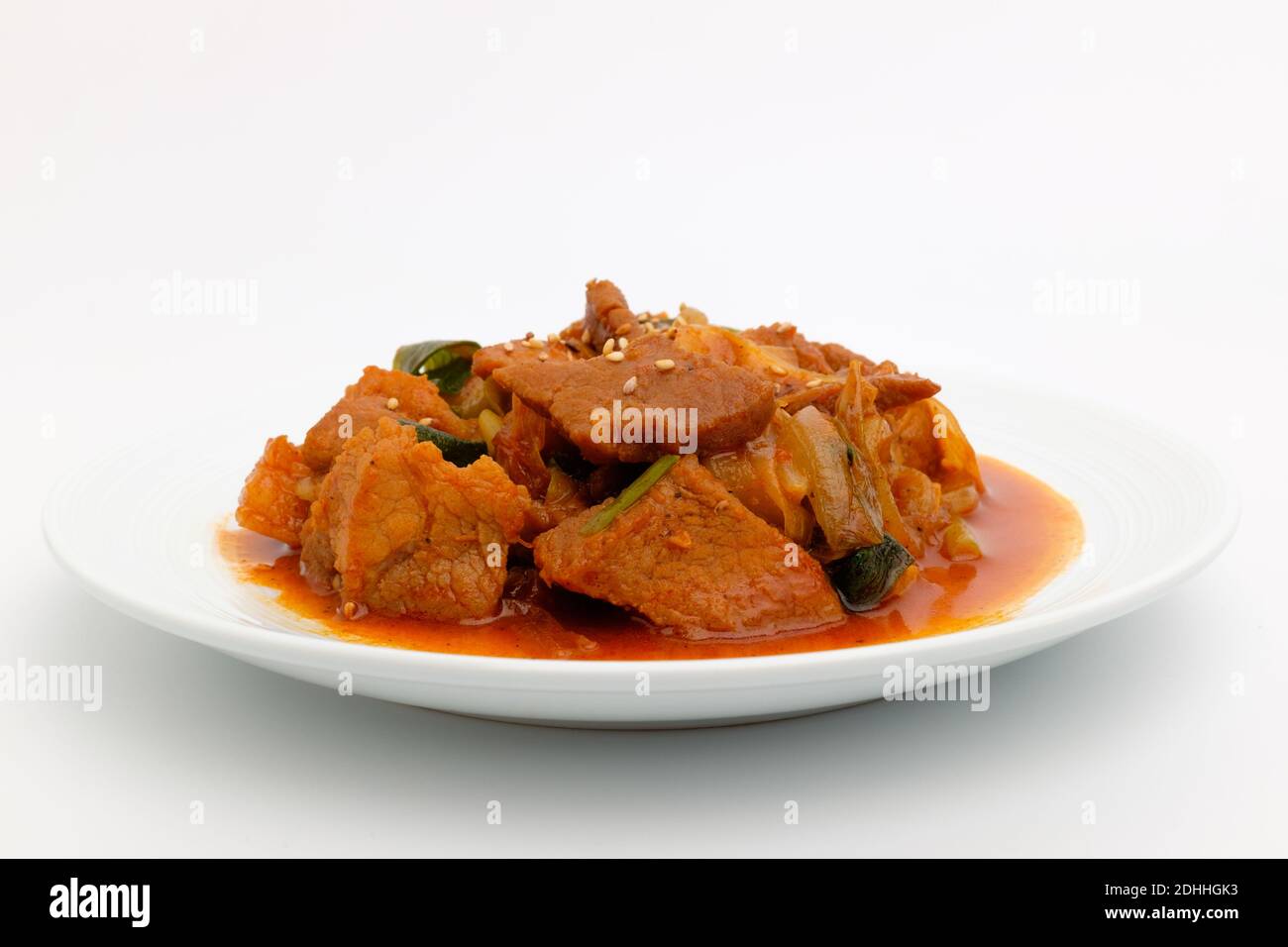 Stir-fried meat on white background Stock Photo - Alamy