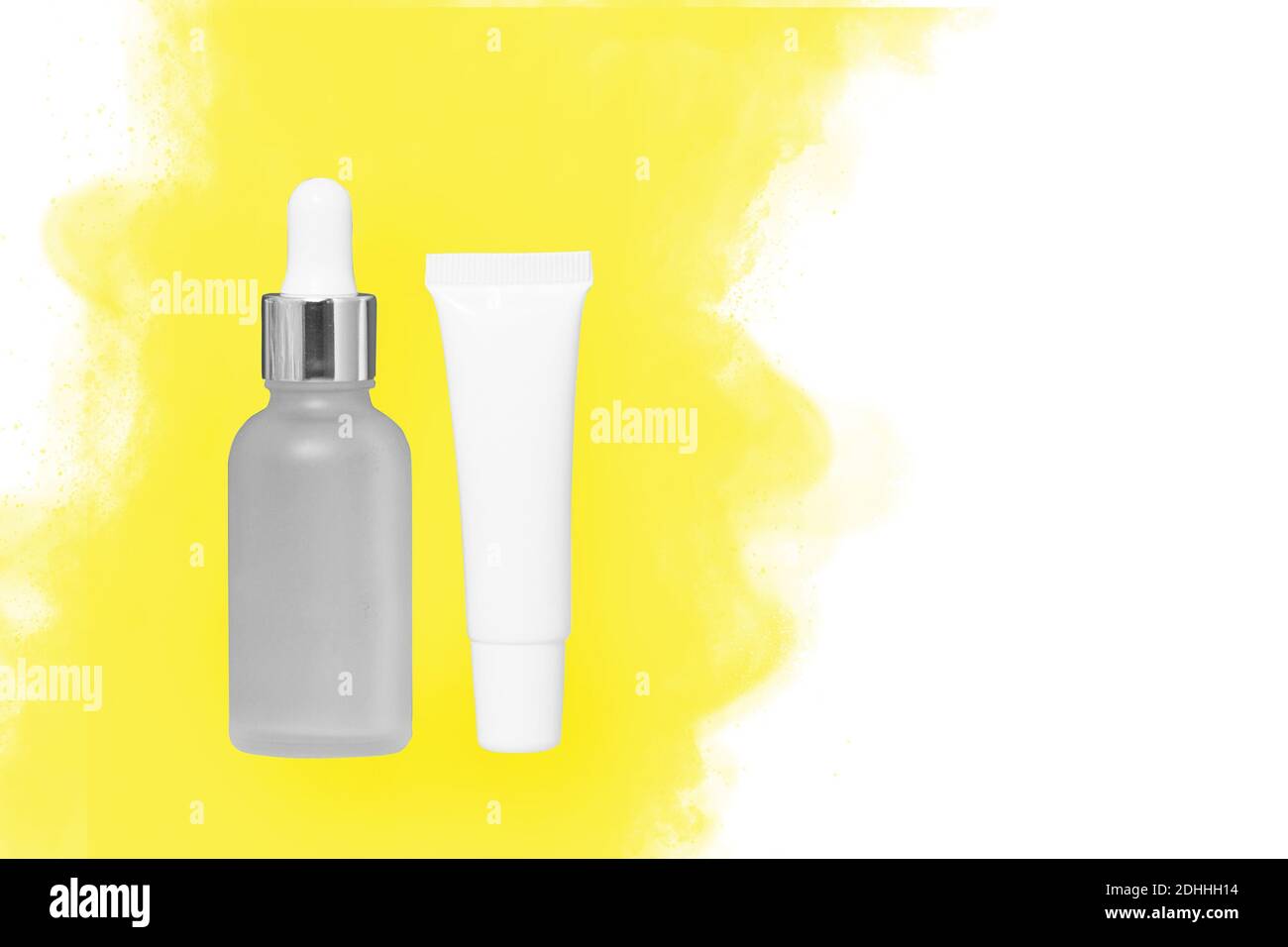 Gray dropper bottle with the white cap and white plastic tube on the ...